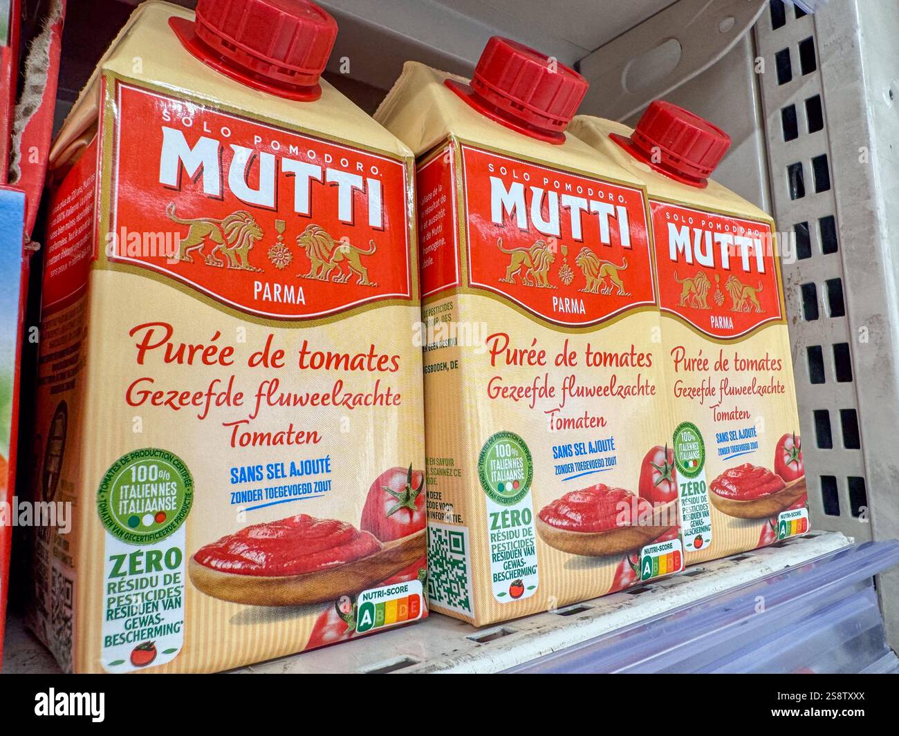 Flavorful tomato puree in beautiful packaging on store shelves Stock ...
