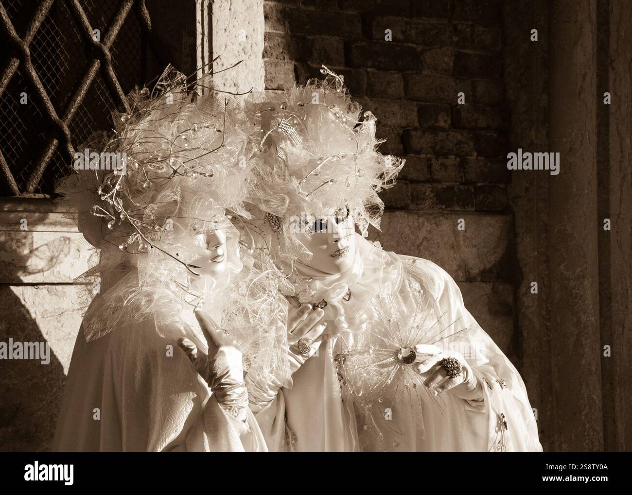 Valentine day in Venice. Two fluffy white masks in St Mark's Square ...