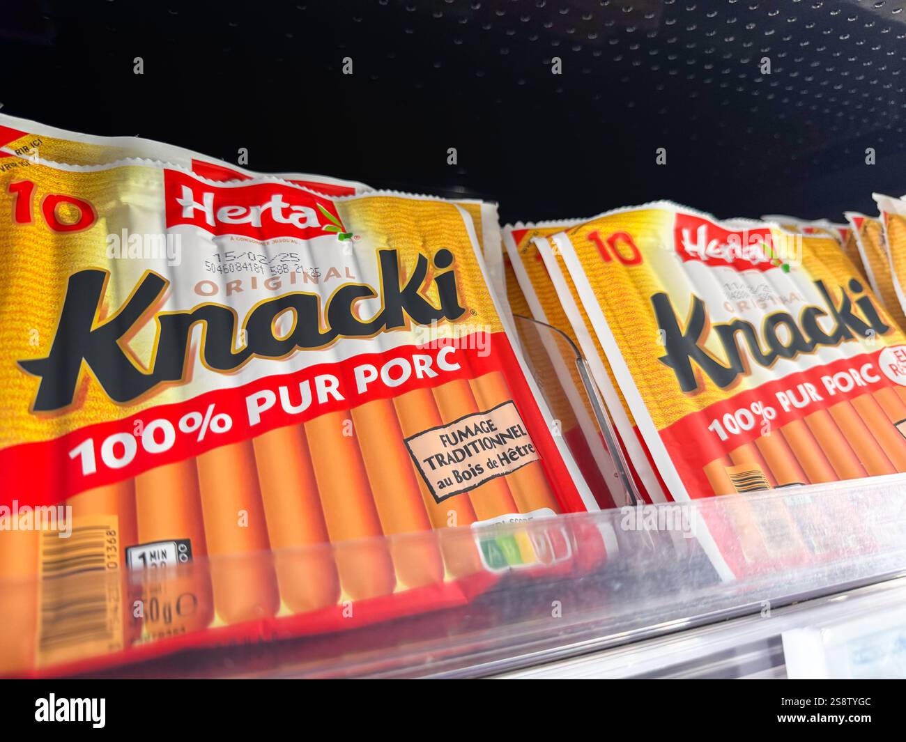 Delicious knacks of spiced sausages displayed on a store shelf near ...
