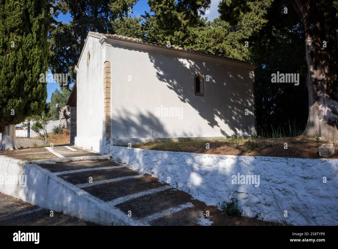 Chapel at a cemetery. Fresh painted white walls and a traditional roof ...