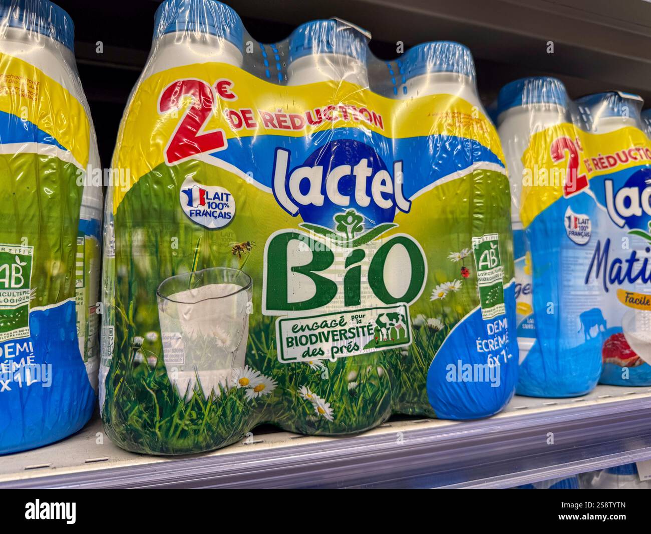 Fresh dairy products on display in a vibrant supermarket setting Stock ...