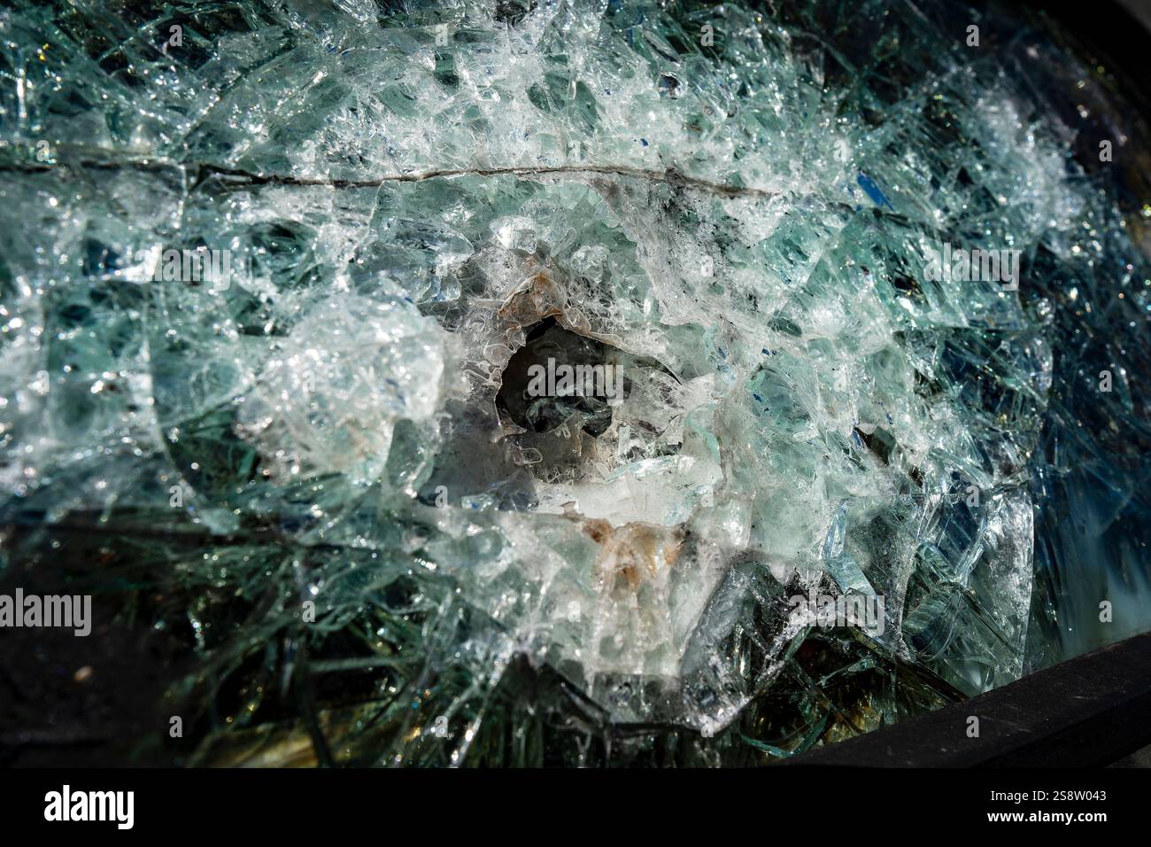 Bullet hole in armor-piercing glass. Armor piercing glass of damaged ...