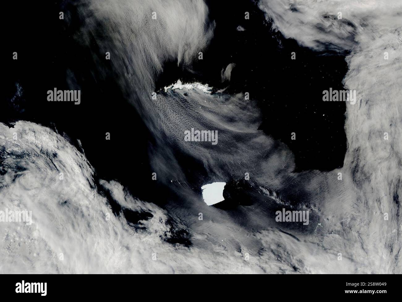 An iceberg seen on NASA’s Aqua satellite, known as A23a, center, is ...