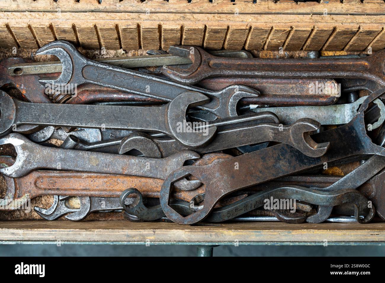 Wooden tool box of hand tools with old and dirty, rusty wrenches, ring ...