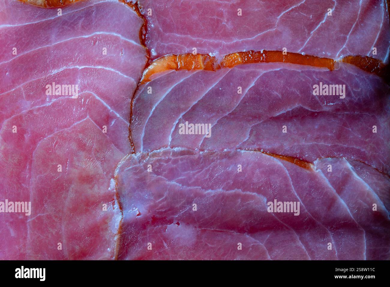 Cold smoked tuna fillet slices in background, close up, top view Stock ...