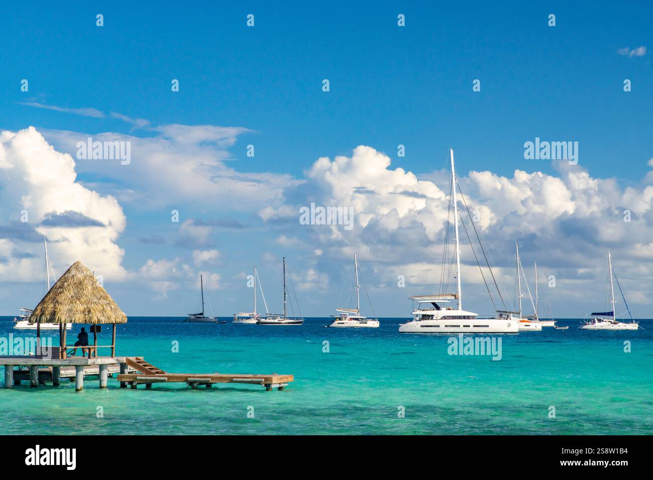 French Polynesia, Rangiroa Atoll. Pier and sailboats Stock Photo - Alamy