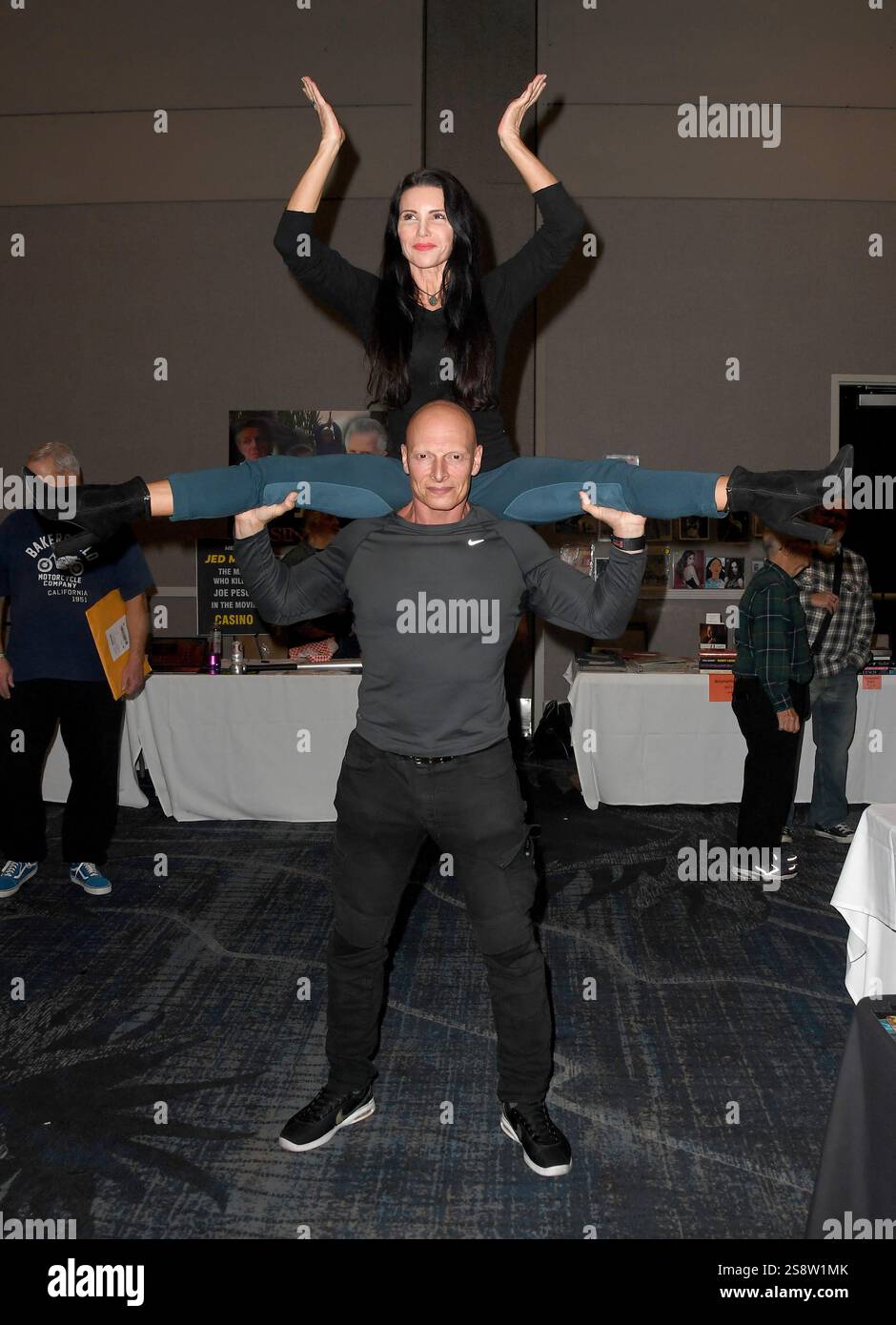 Actors Mercy Malick and Joseph Gatt perform an acrobatic act at the ...