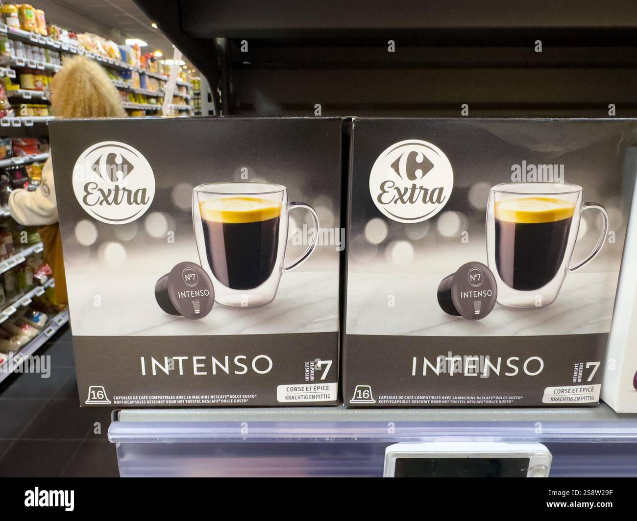 Coffee capsules on store shelf featuring intense flavor blend Stock ...