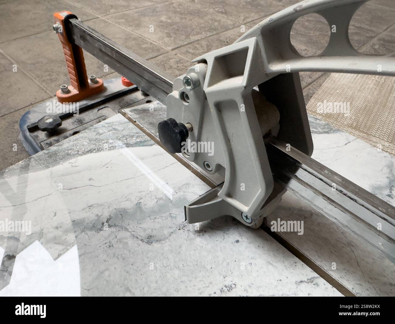Precision cutting tool operates on marble slab in workshop Stock Photo ...