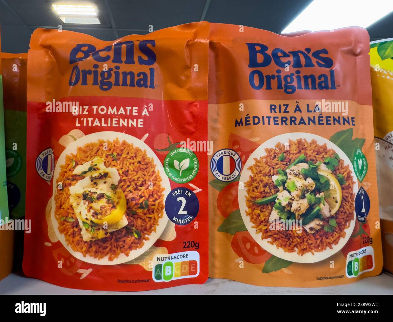 Two pouches of flavored rice are showcased on a supermarket shelf Stock ...