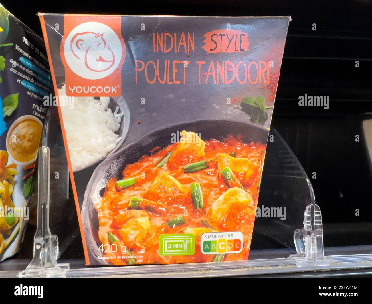 Indian style tandoori chicken meal box on store shelf with rice Stock ...