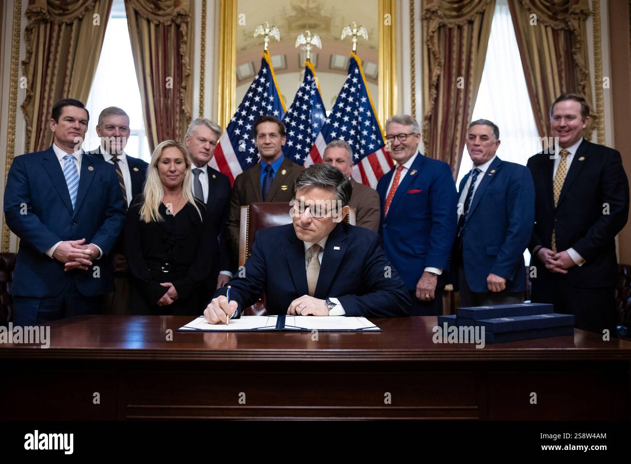 House Speaker Mike Johnson (R-La.), flanked by members of Georgia's ...