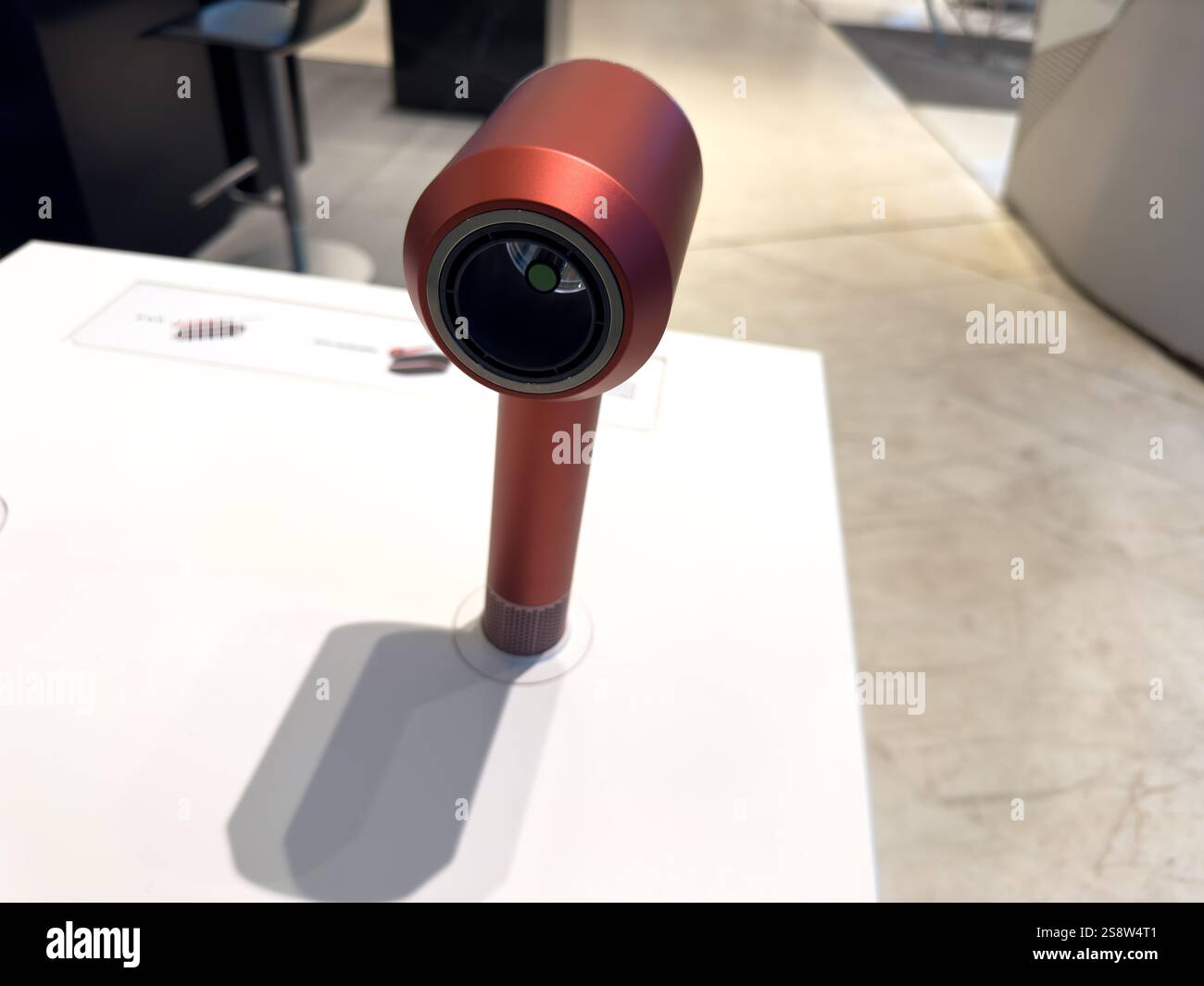 Innovative handheld device showcased at technology exhibition in modern ...