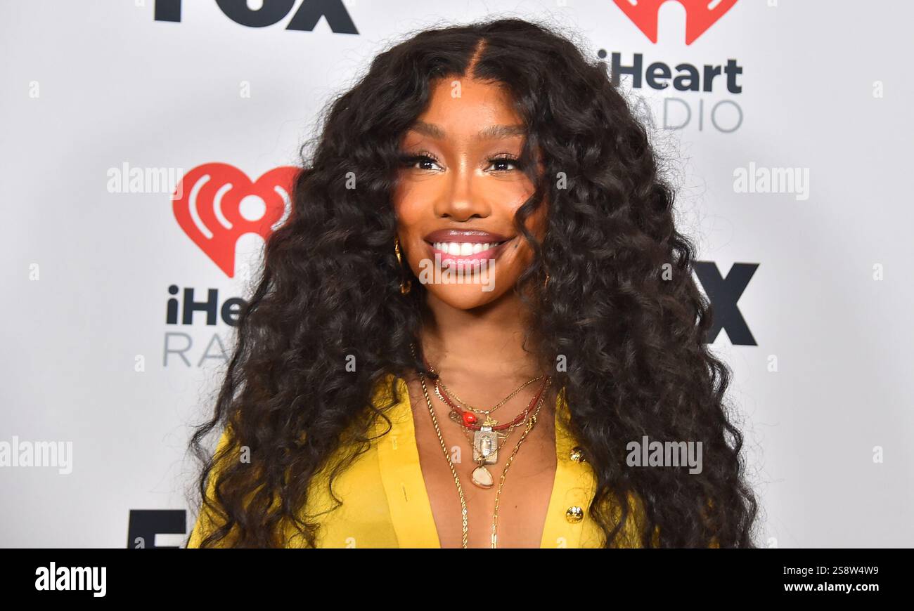 FILE - SZA poses in the press room at the iHeartRadio Music Awards on ...