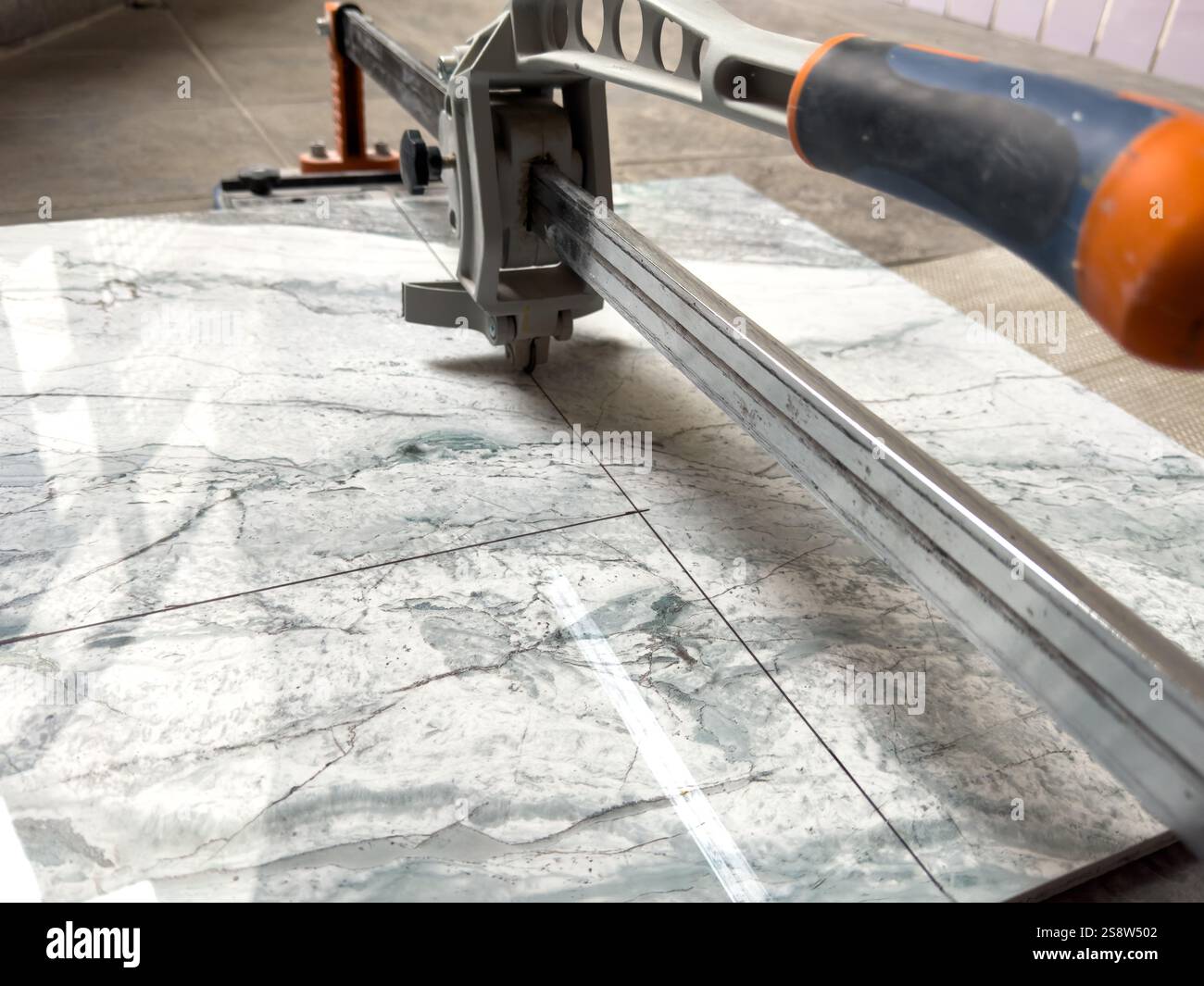Cutting marble tiles for a home renovation project in a workshop Stock ...