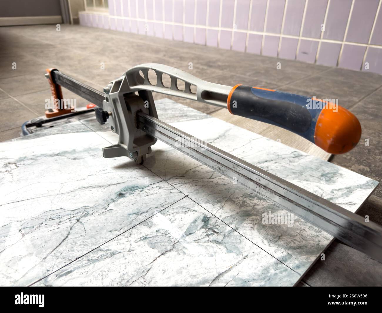 Tool set up for cutting tiles in a home renovation project Stock Photo ...