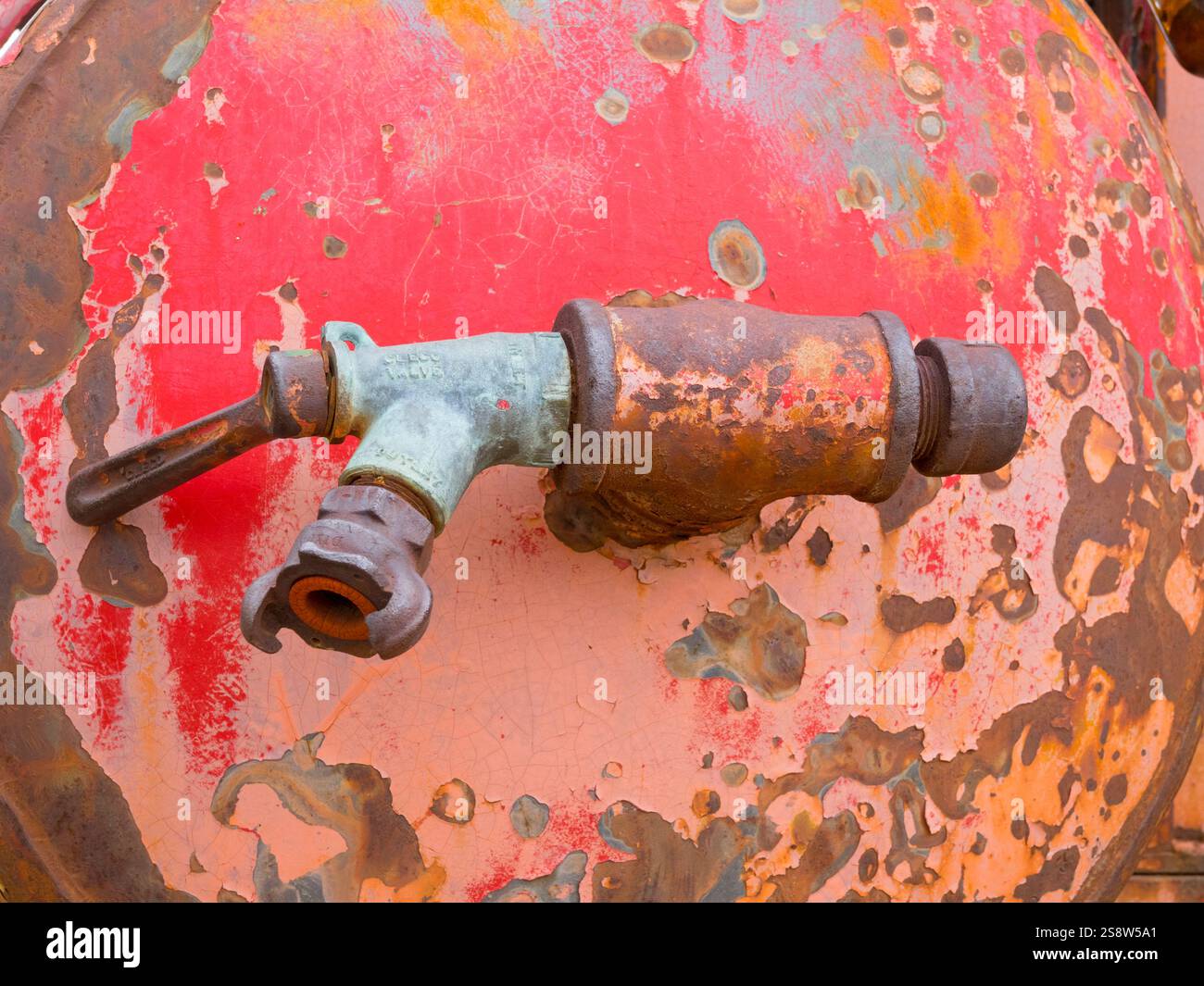 Arizona. Old iron water tank and faucet Stock Photo - Alamy