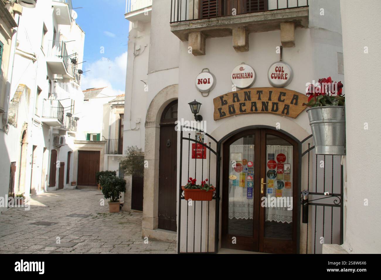 Noci, Italy. Entrance to a restaurant in the historical center ...