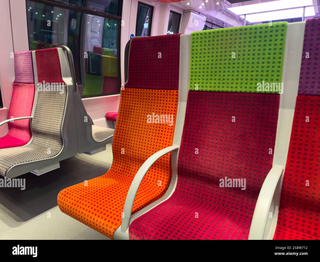 Brightly colored train interior featuring unique seating design Stock ...