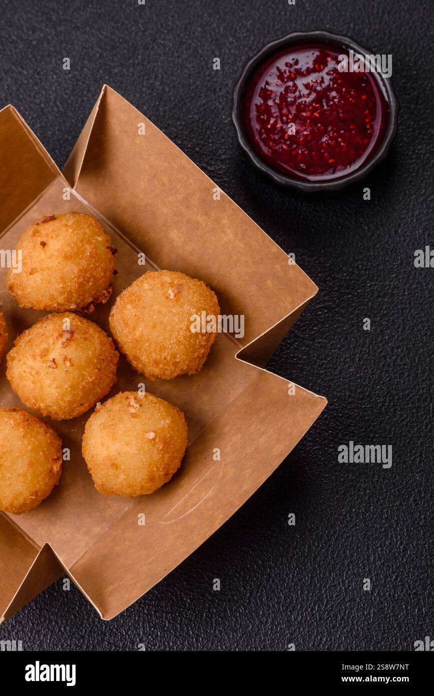 Crispy French fries with camembert or mozzarella cheese with cranberry ...