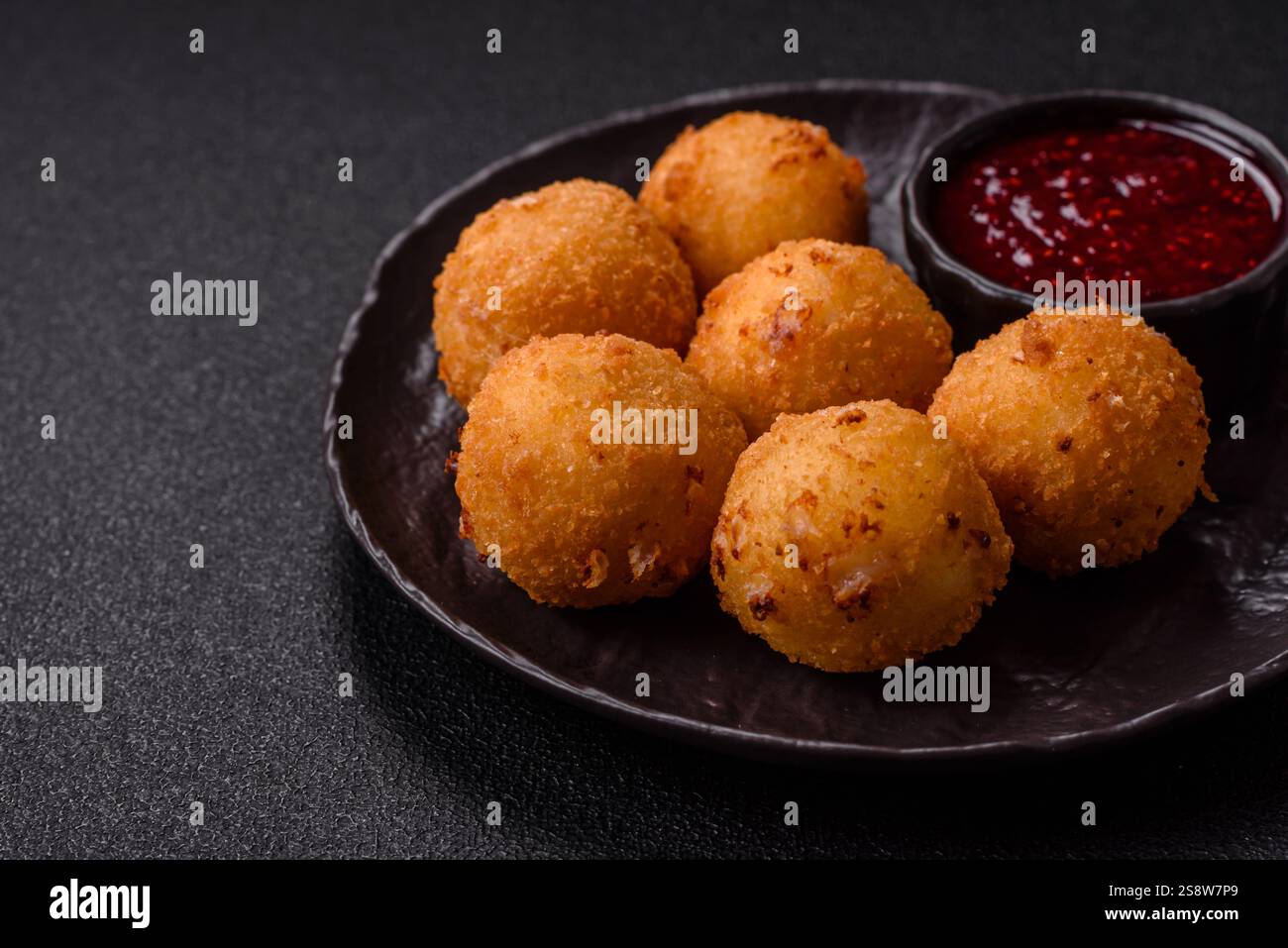 Crispy French fries with camembert or mozzarella cheese with cranberry ...