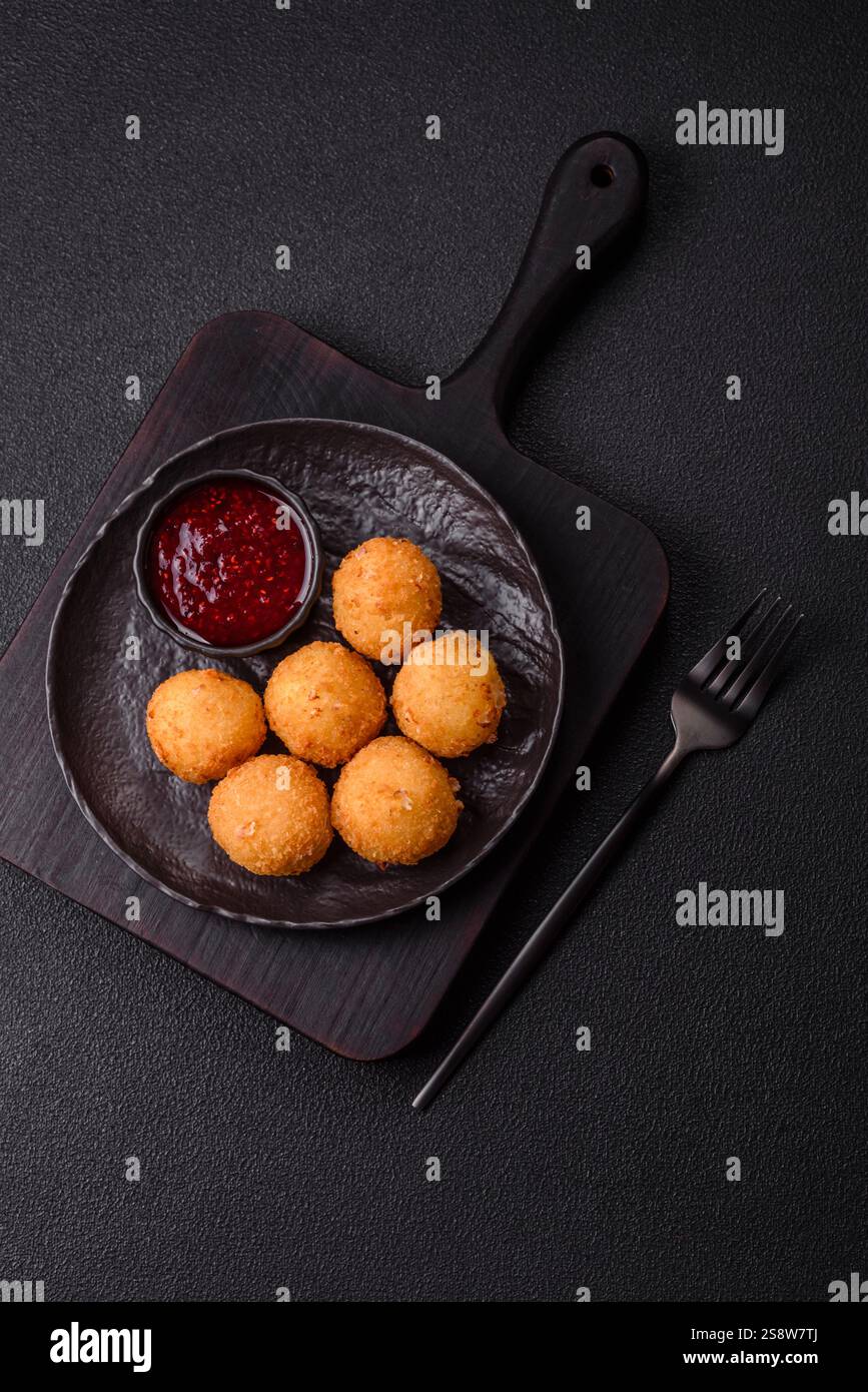 Crispy French fries with camembert or mozzarella cheese with cranberry ...