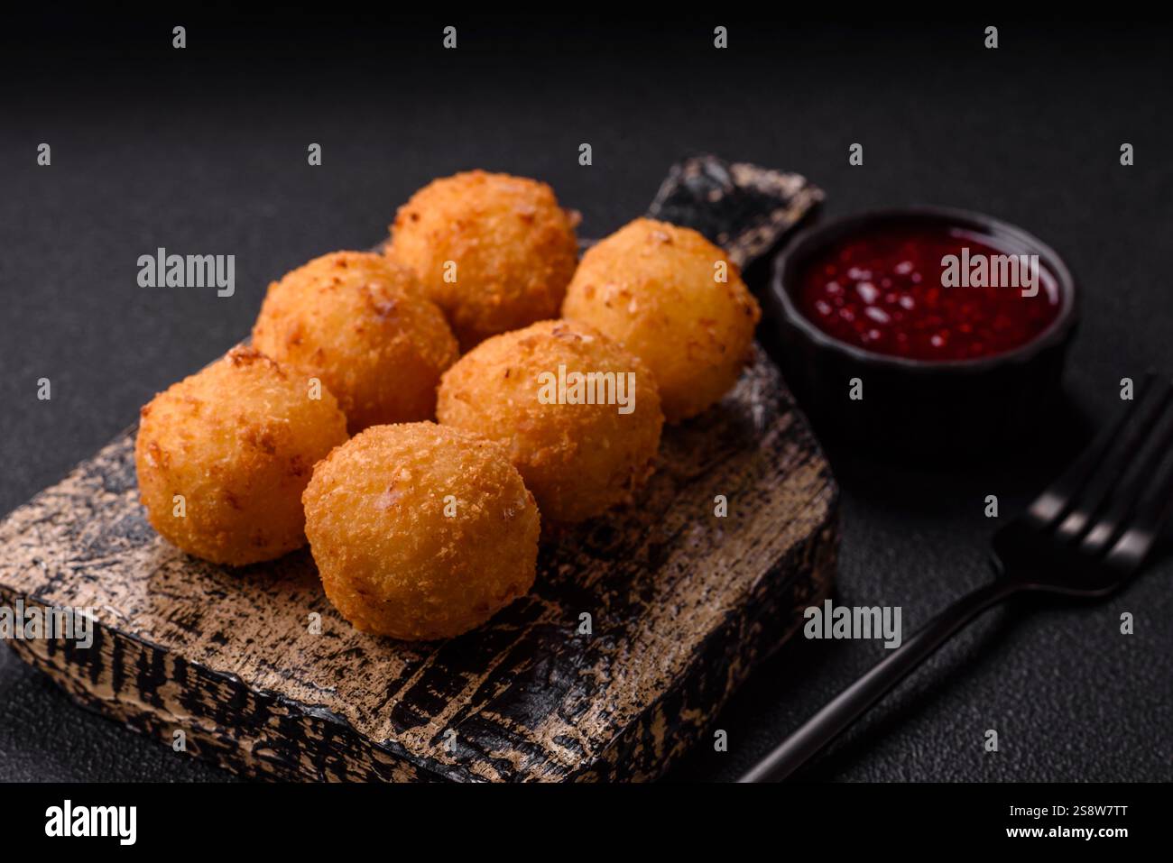 Crispy French fries with camembert or mozzarella cheese with cranberry ...