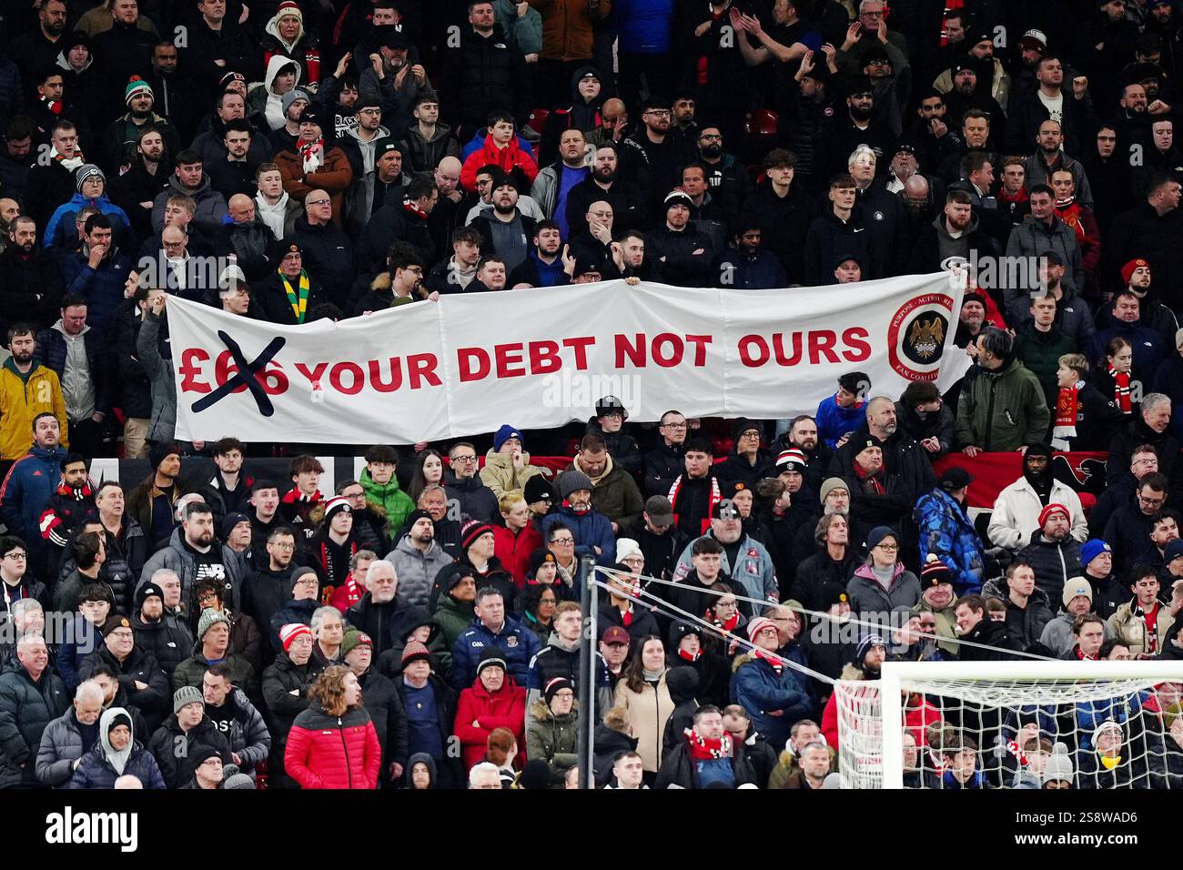 Manchester United fans unveil a banner in protest of increased matchday ...