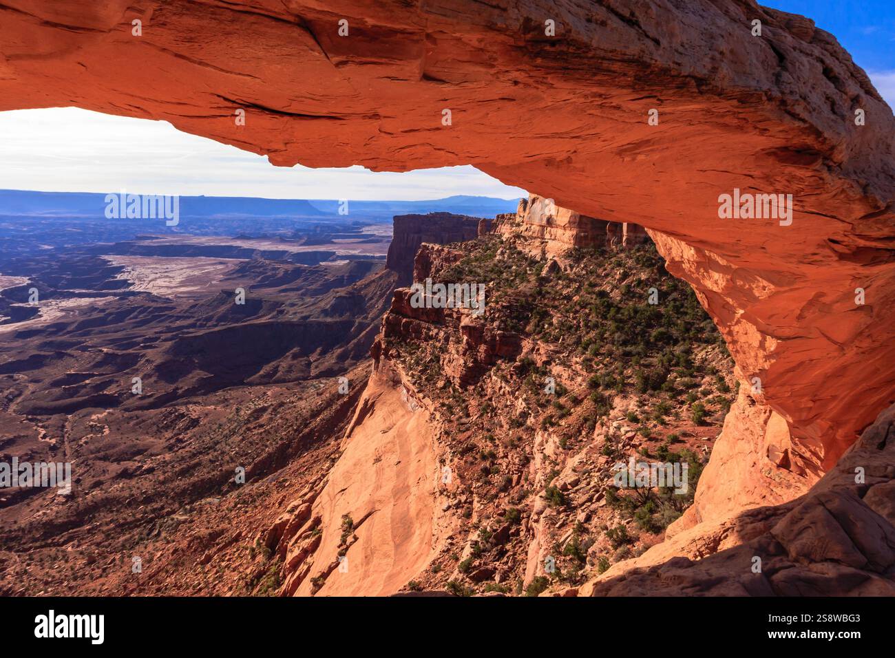 Mesa Arch spans 90 feet and stands at the edge of a mesa precipice ...