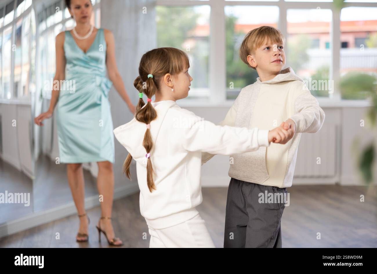 Tween dancers, girl and boy practicing waltz in dance studio Stock ...