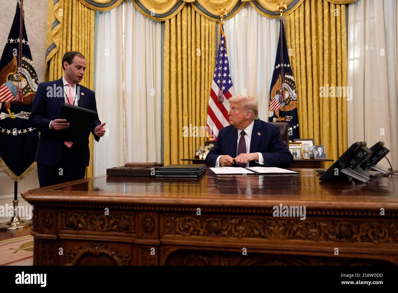 President Donald Trump talks with White House staff secretary Will ...