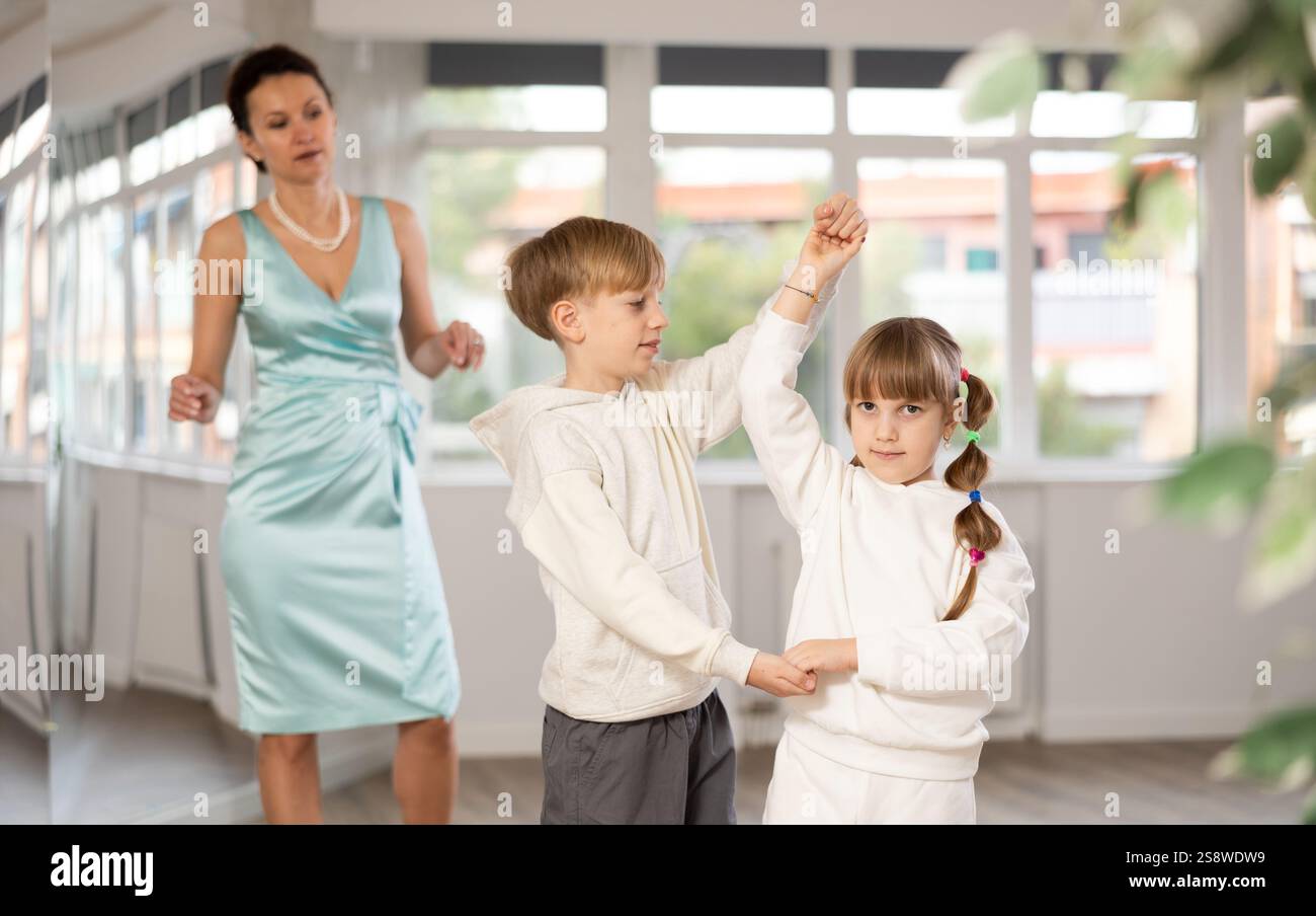 Tween dancers, girl and boy practicing waltz in dance studio Stock ...