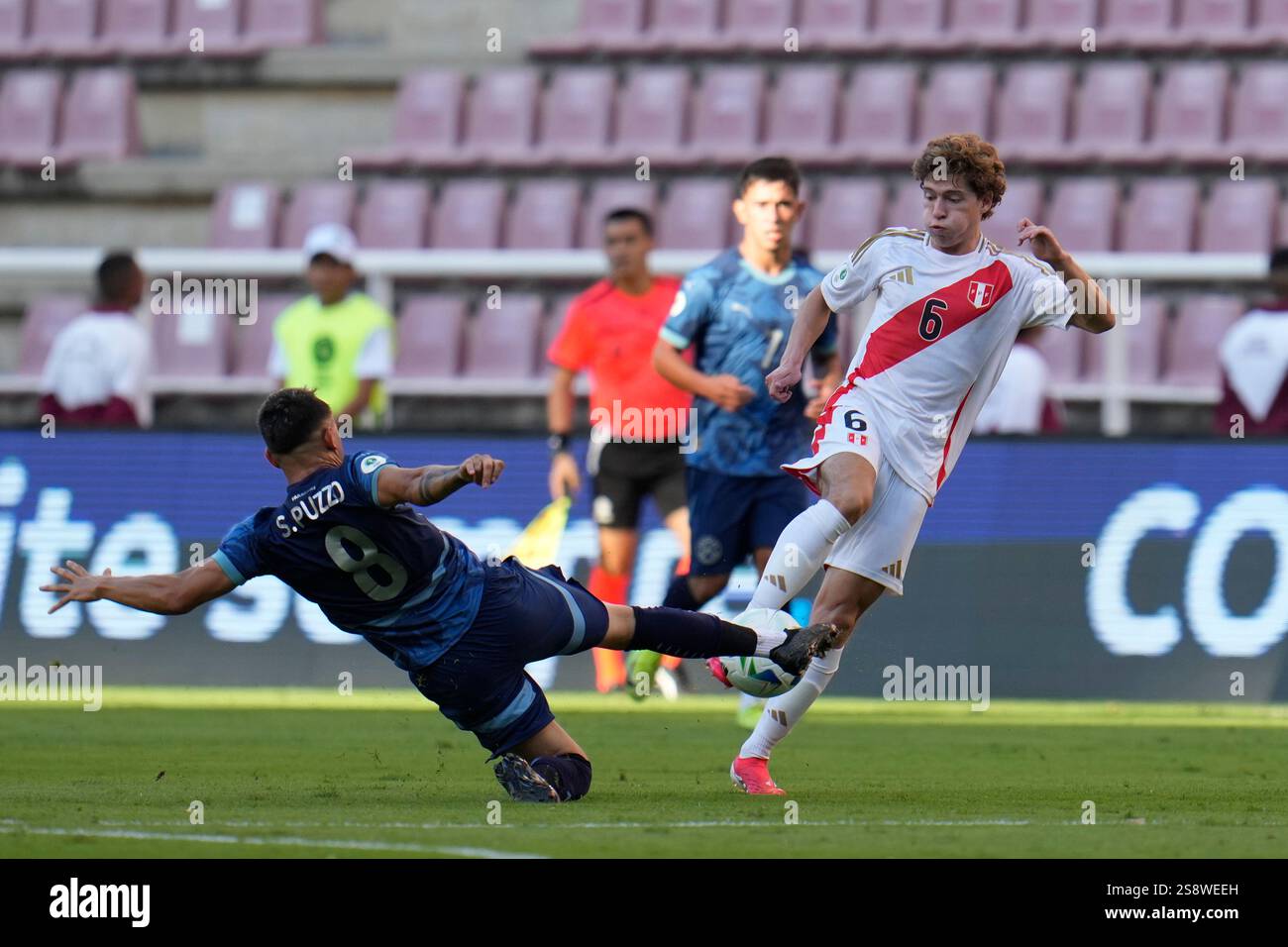 Paraguay's Santiago Puzzo, left, and Peru's Ian Wisdom fight for the ...