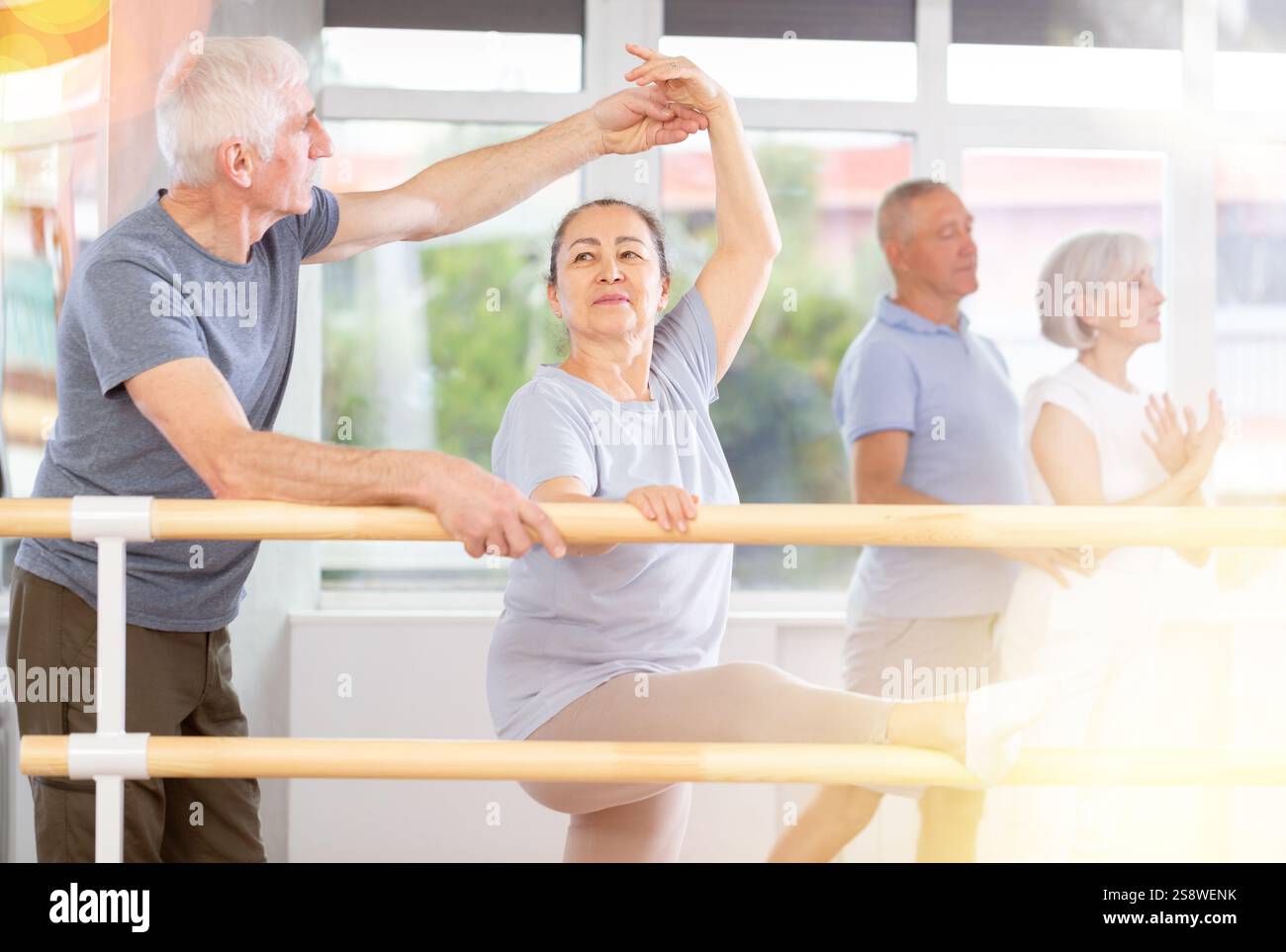 Male choreographer teaches elderly ballet lovers to stand in grand ...