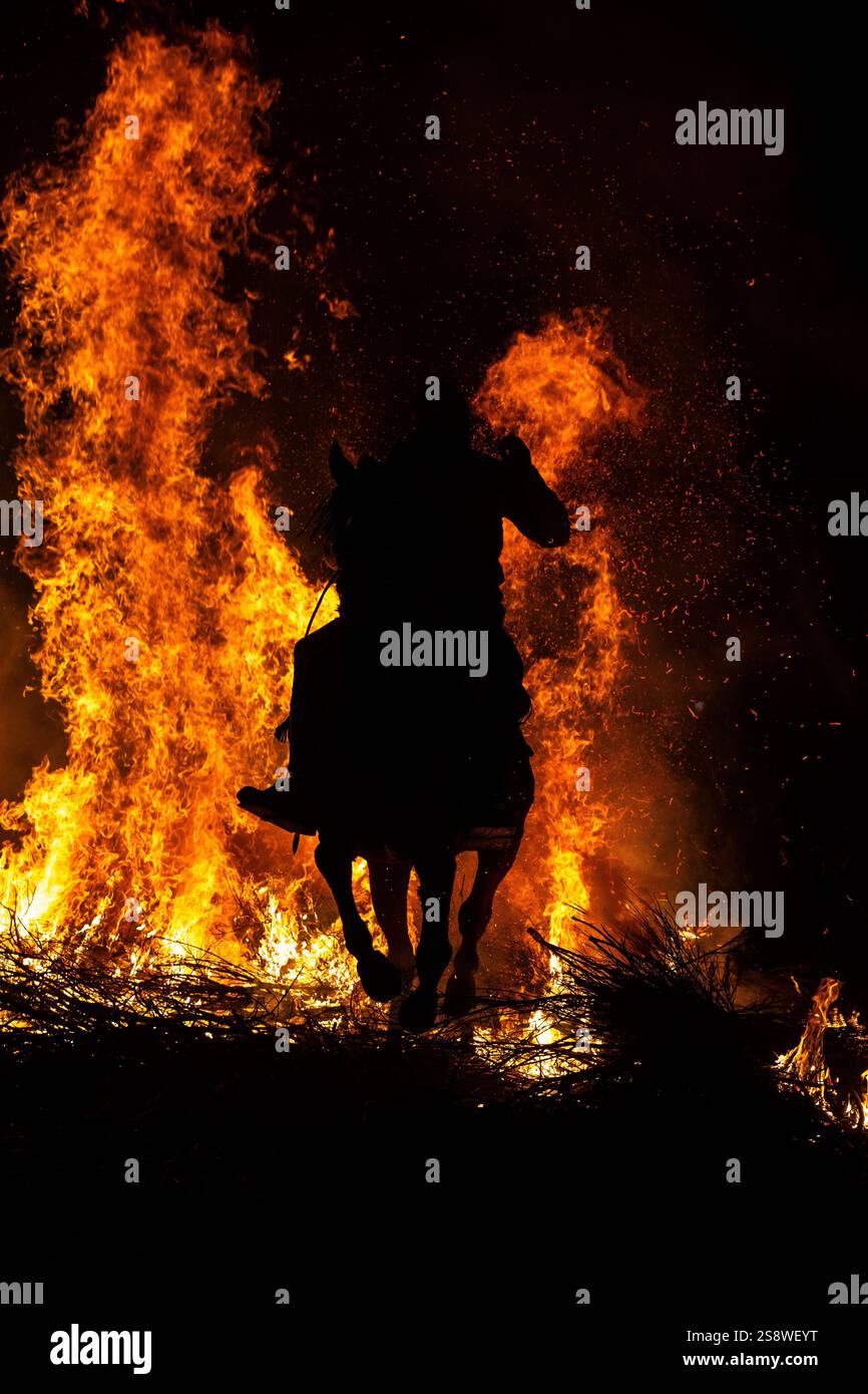 16 January 2025, Knights cross bonfires with their horses in an ancient ...