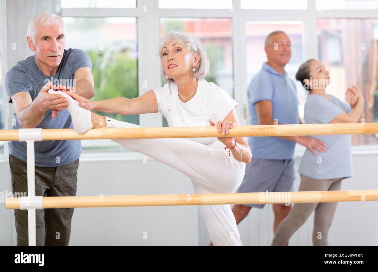 Male choreographer teaches elderly ballet lovers to stand in grand ...