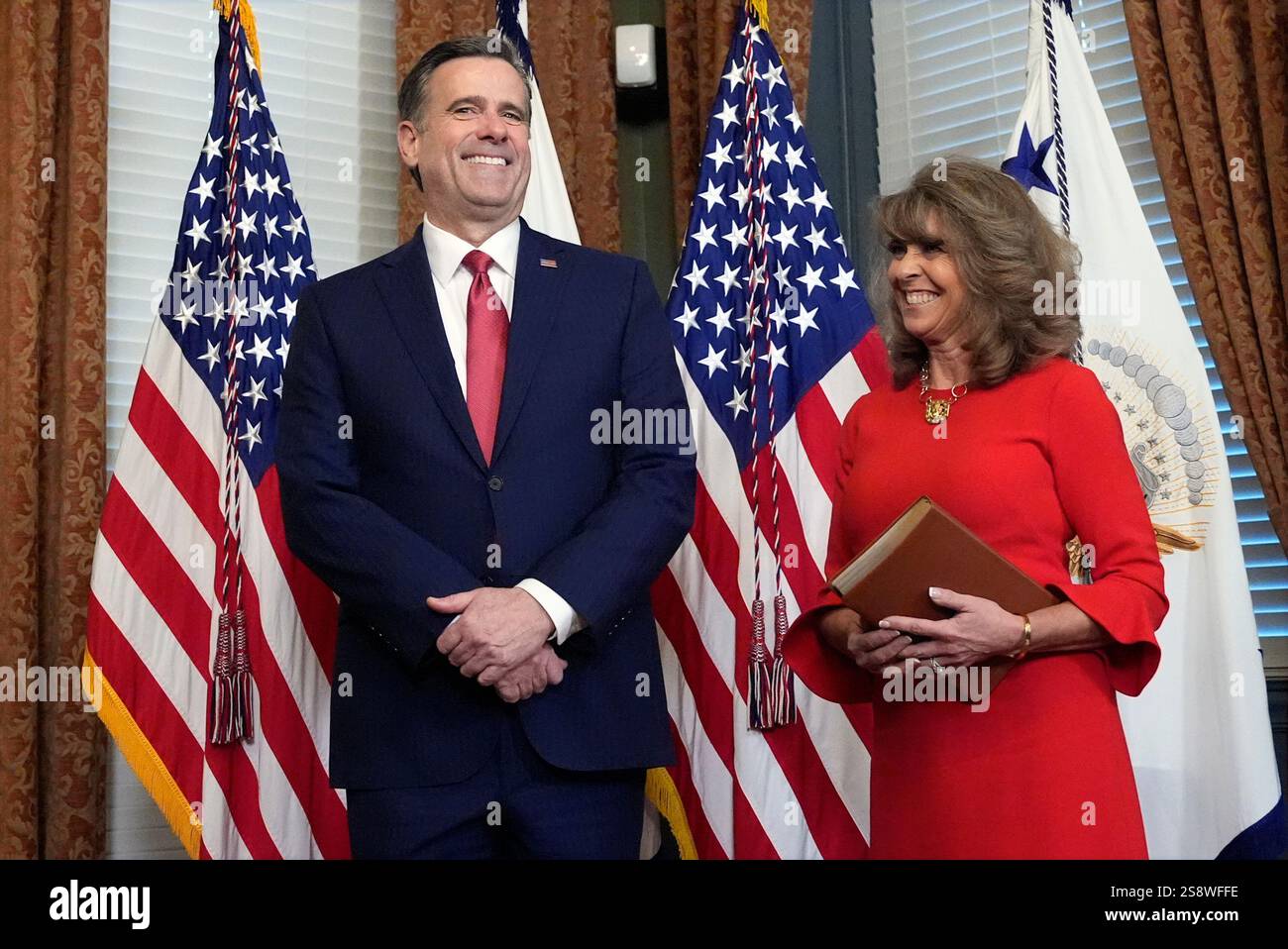 John Ratcliffe and his wife Michele smile as Vice President JD Vance ...