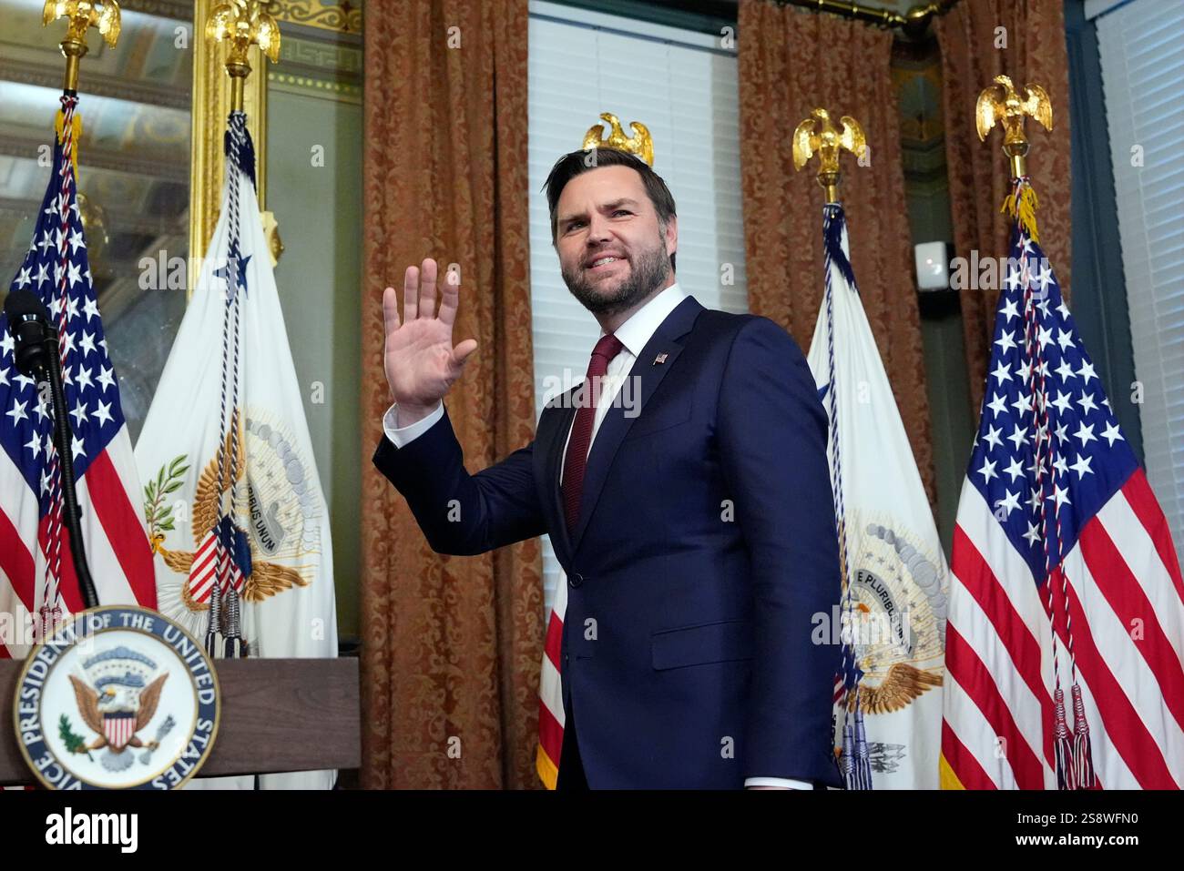 Vice President JD Vance waves after swearing in John Ratcliffe as CIA ...