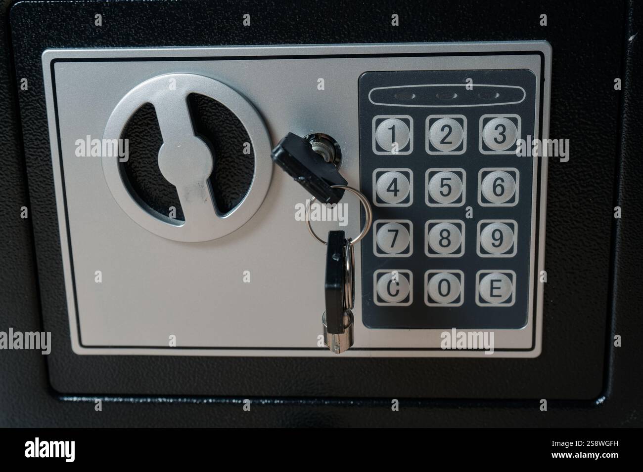Safe or home security box with key and digital keypad Stock Photo - Alamy