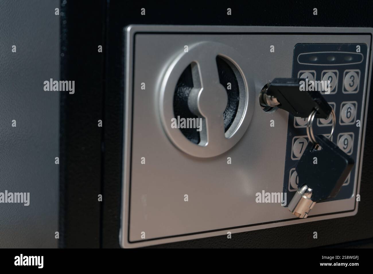 Safe or home security box with key and digital keypad Stock Photo - Alamy