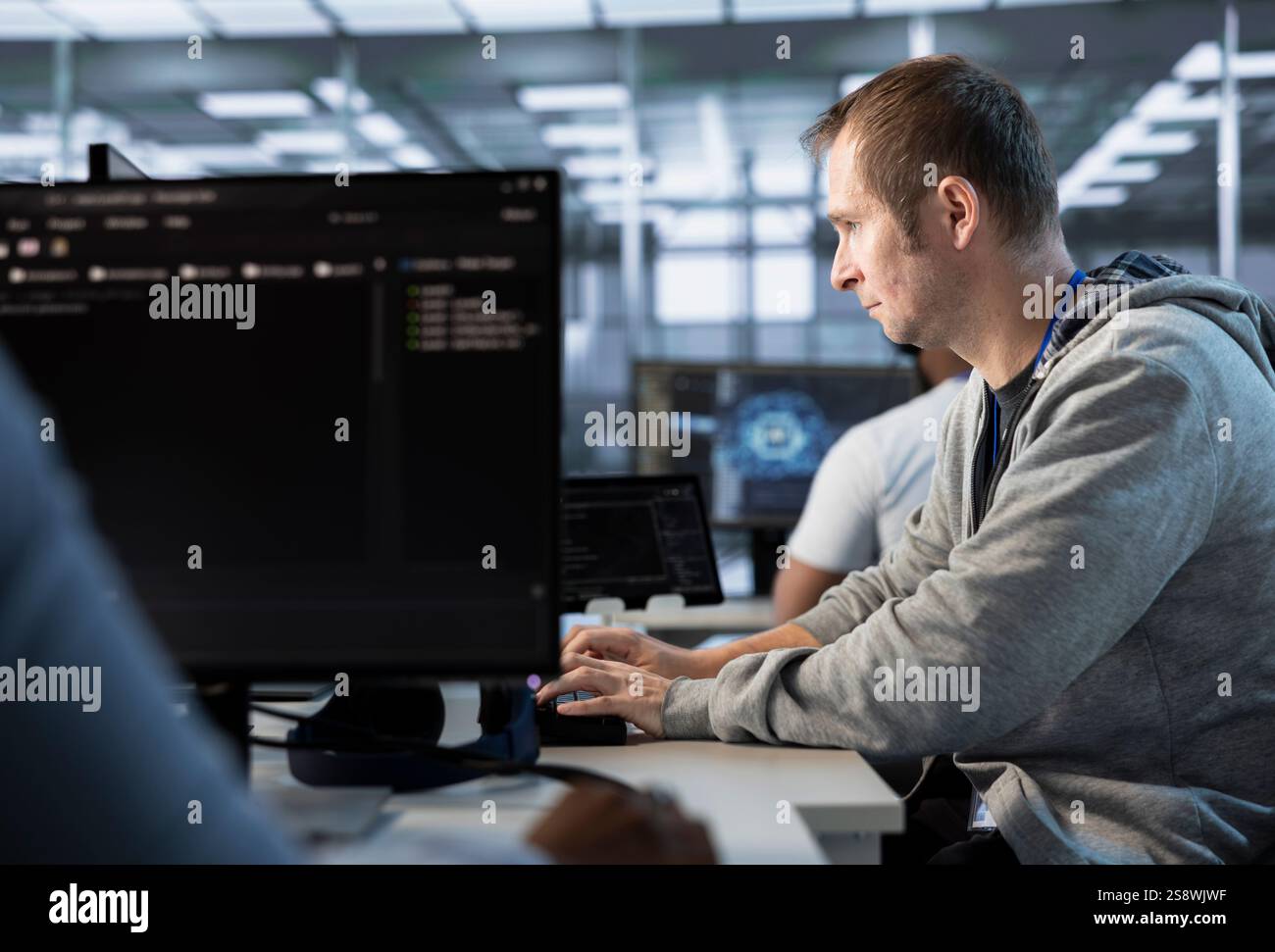 Man getting PC crash while trying to fix error in high tech data center ...
