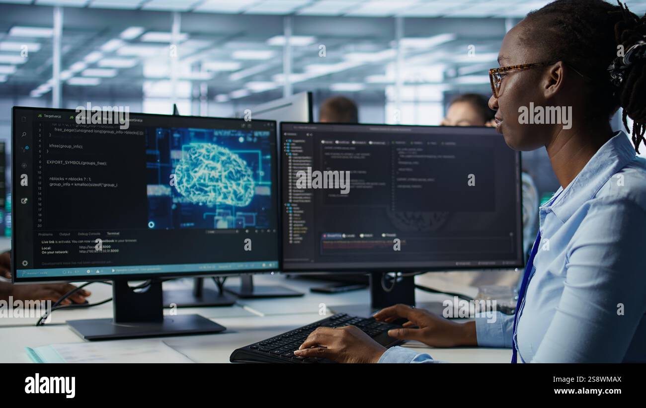 Woman programming in AI data center housing advanced equipment used for machine learning ...