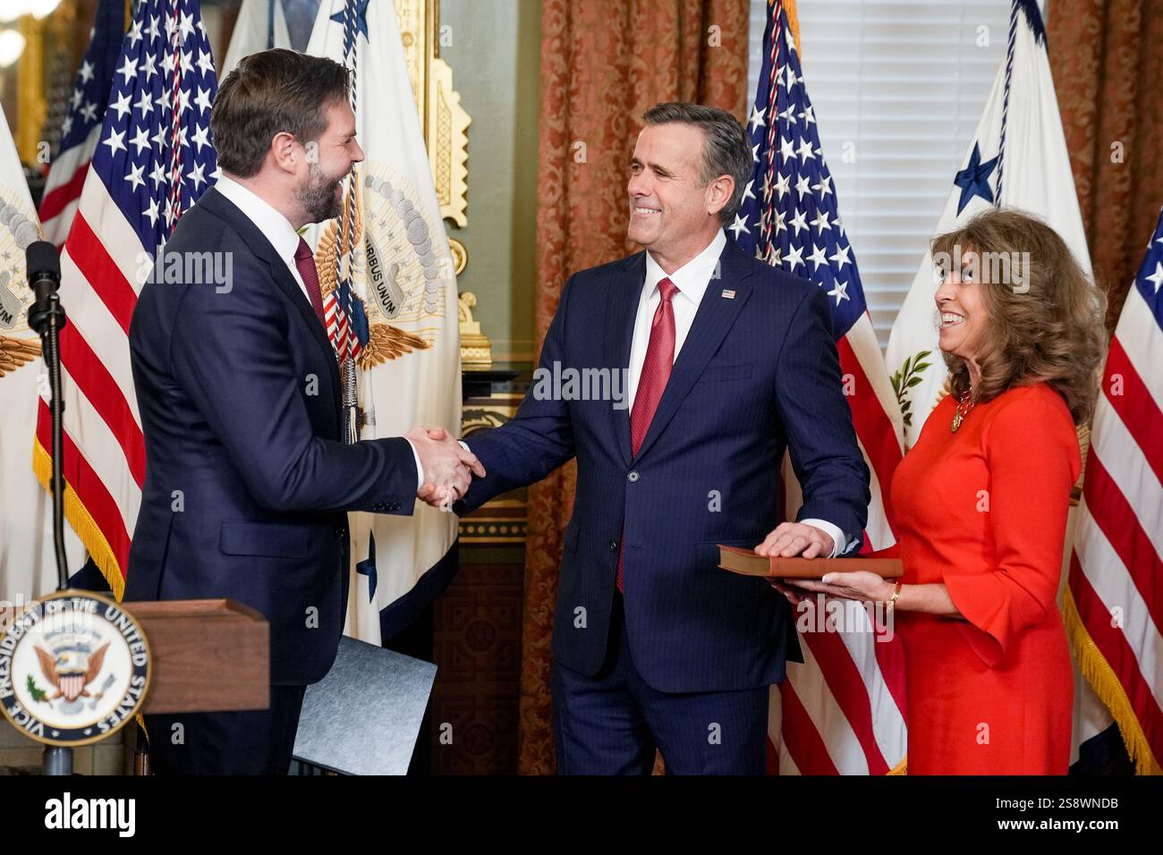 New CIA Director John Ratcliffe (C), with his wife Michele (R), shakes ...