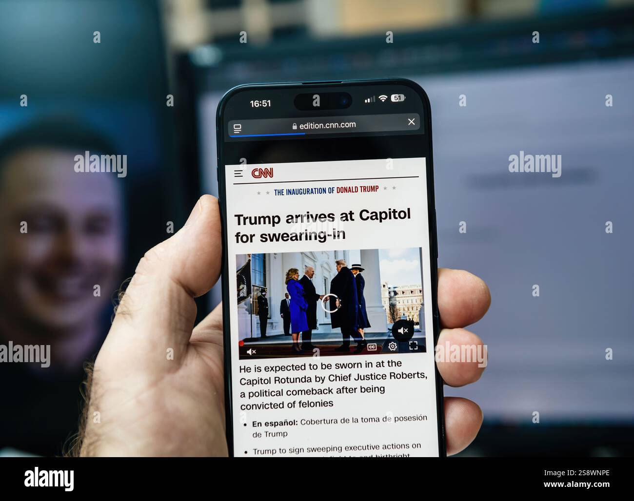 Paris, France - Jan 20, 2025: A hand holds an iPhone displaying a CNN ...