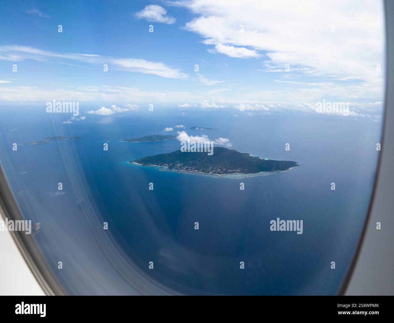 View through airplane window, porthole of an airplane that flying above ...