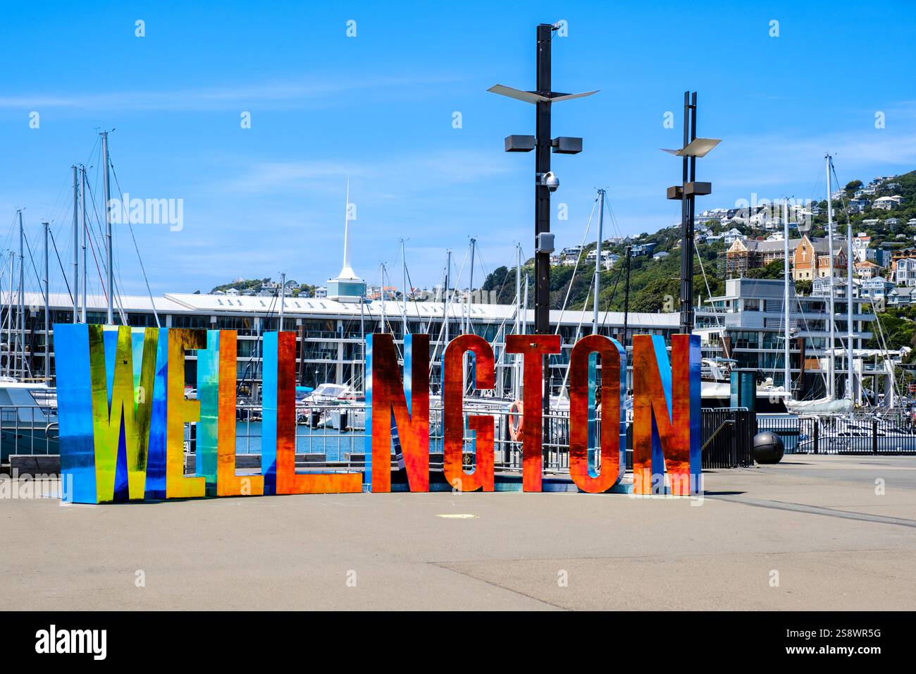 Colorful Wellington sign walkway, scenic waterfront marina promenade ...