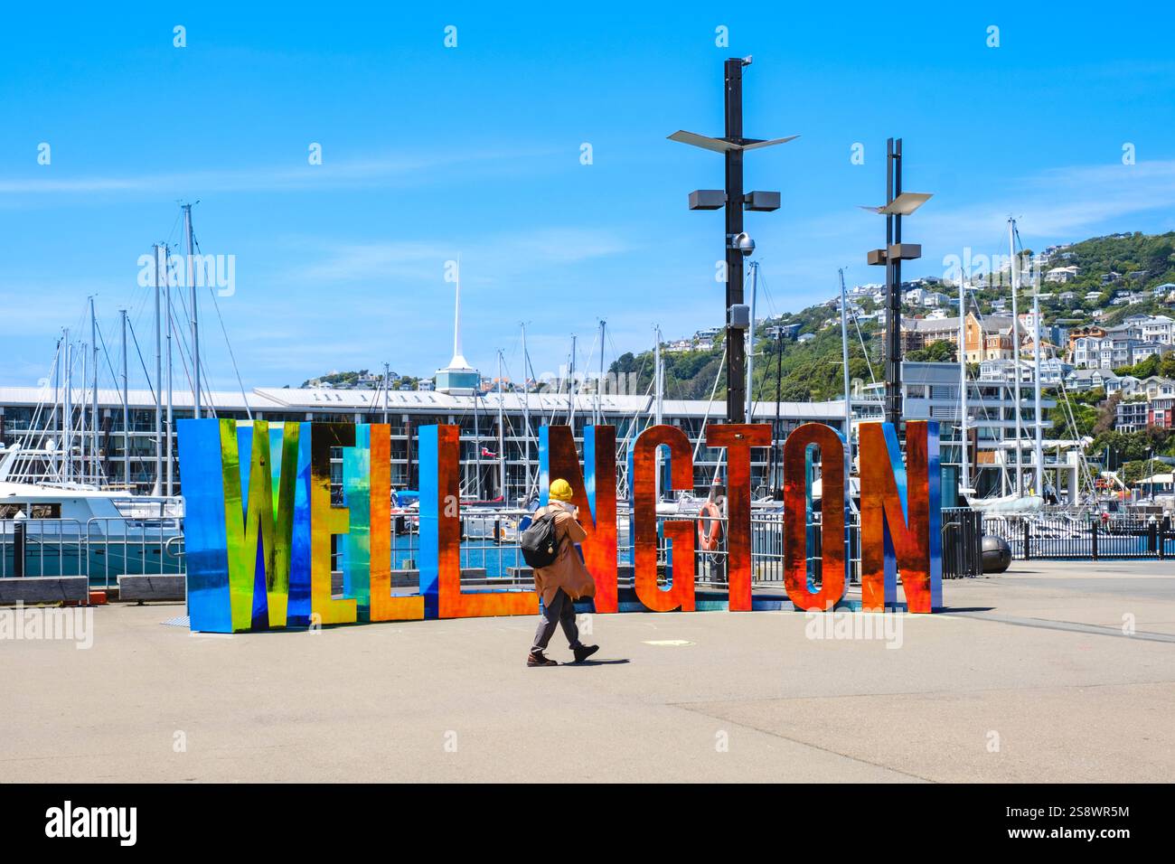 Colourful Wellington sign walkway, scenic waterfront marina promenade ...