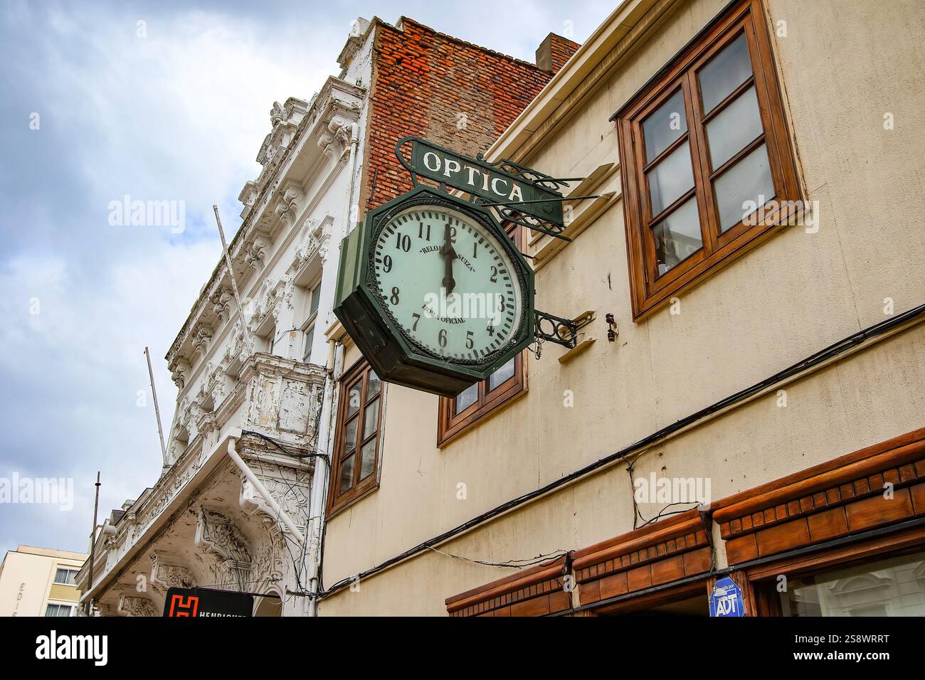 Public clock on a wall in Punta Arenas, the southernmost town in Chile ...