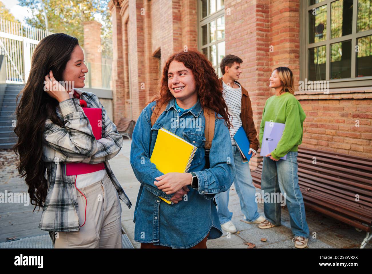 Diverse classmates chatting in hi-res stock photography and images - Alamy