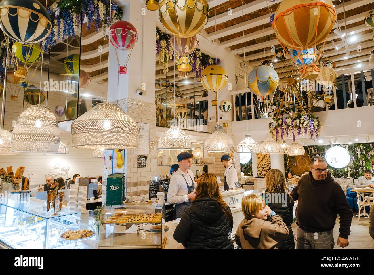 Inside a charming cafe in Barcelona, Spain, decorated with hot air ...